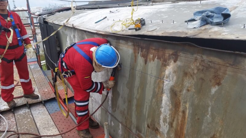 Collapsed oil storage tank repair using a pneumatic angle grinder | TFT ...