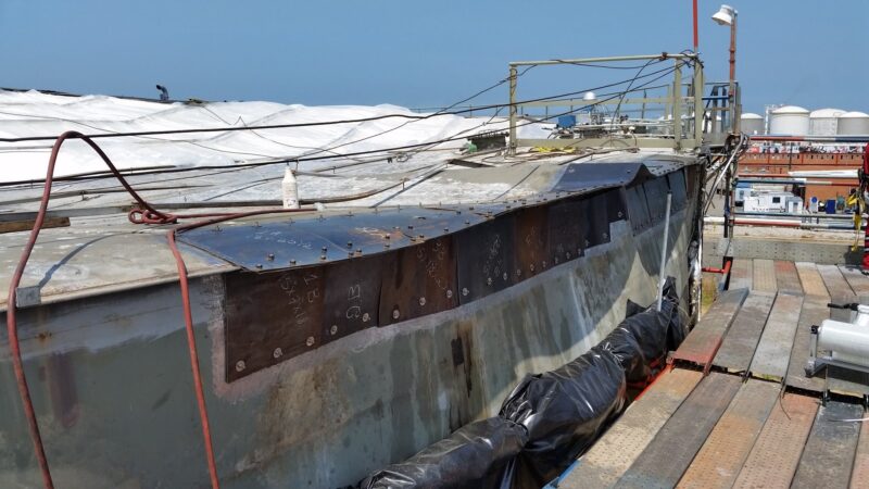 Collapsed oil storage tank repair using a pneumatic angle grinder | TFT ...