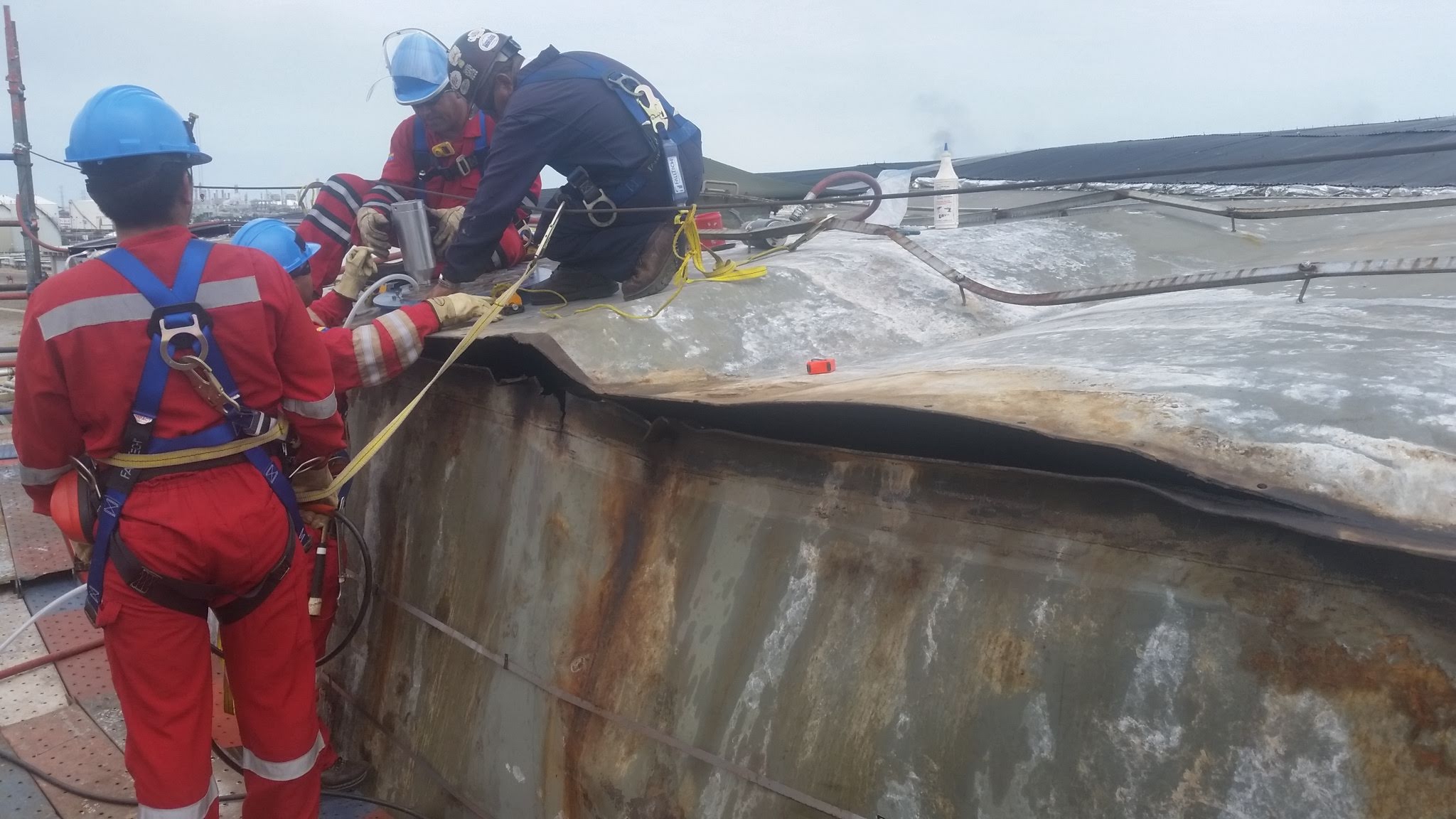 Collapsed oil storage tank repair using a pneumatic angle grinder | TFT ...